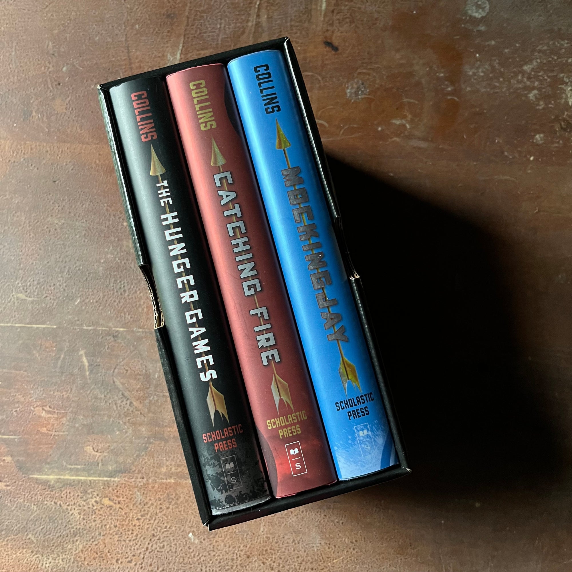 The Hunger Games Trilogy Box Set Written by Suzanne Collins - Log Cabin ...